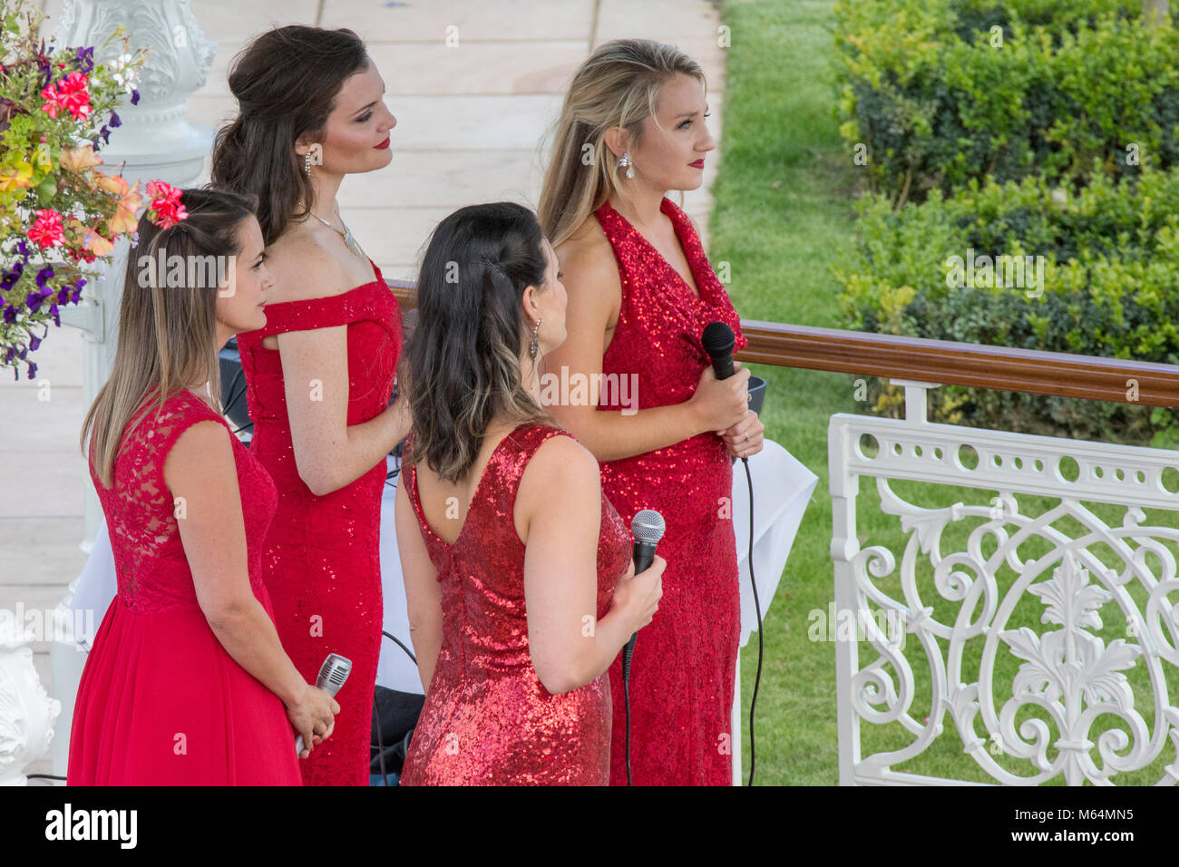 Girl in red singing hi-res stock photography and images - Alamy