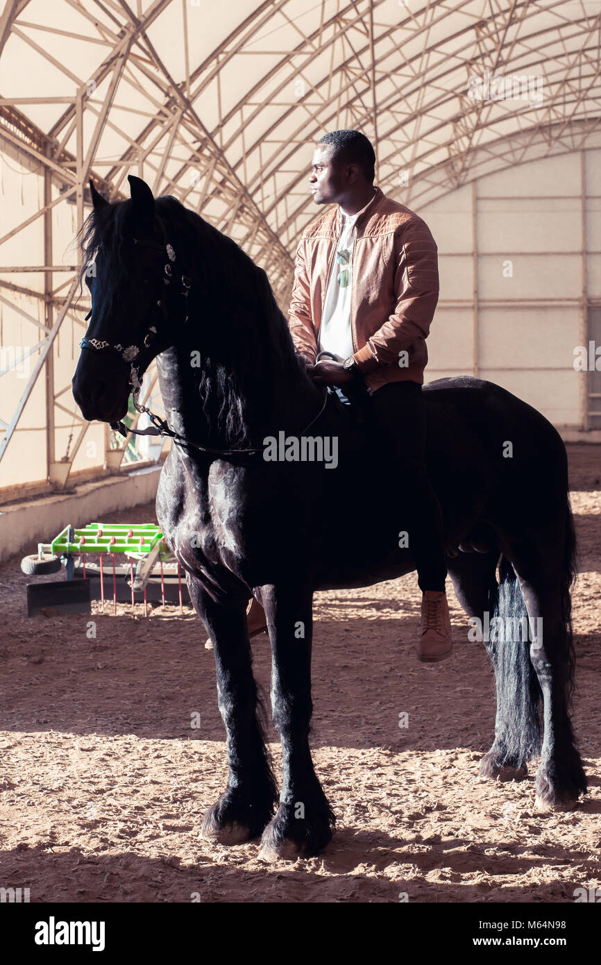 African horse riding helmet hi-res stock photography and images - Alamy