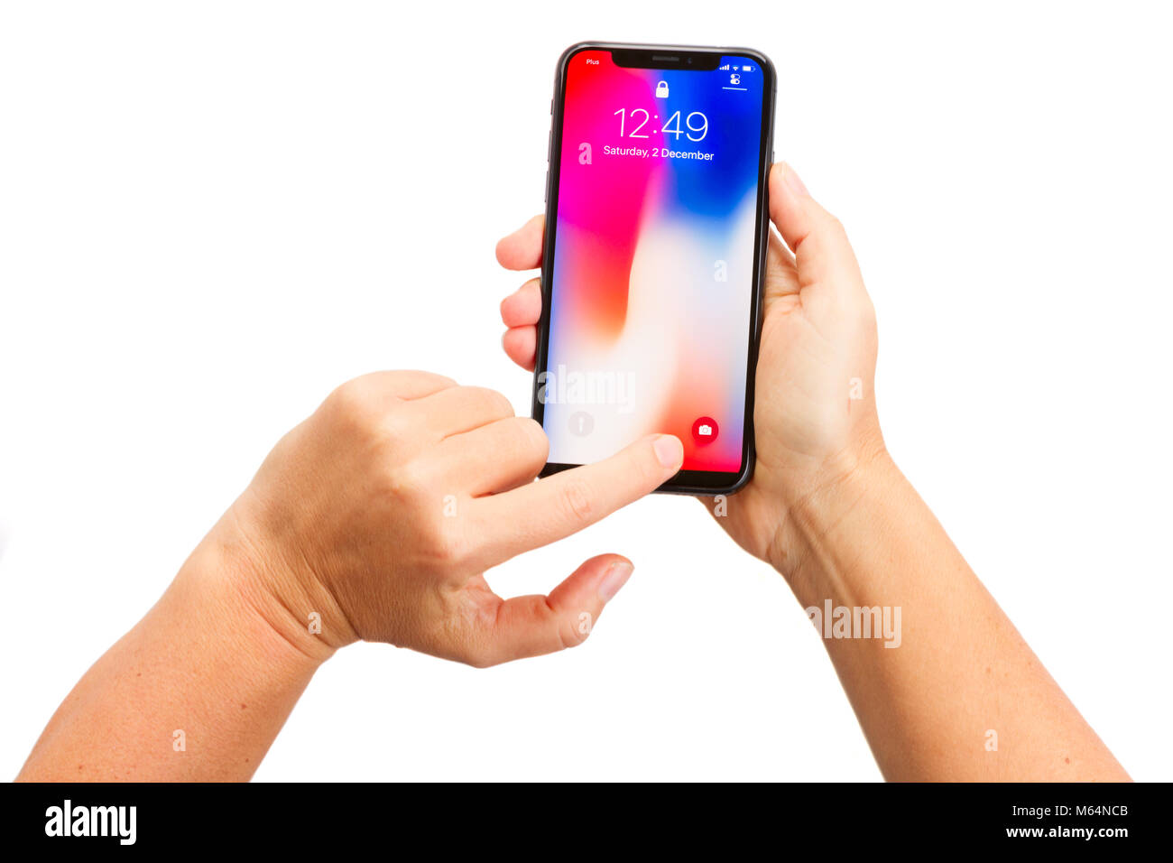 WARSAW, POLAND - DECEMBER 02: Two hands holding and touching new Iphone ...