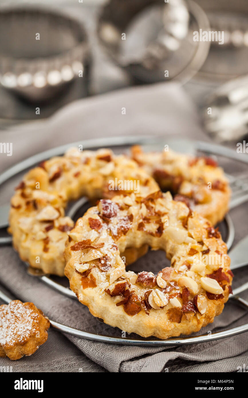 Ring shortbread cookies with peanuts on top Stock Photo - Alamy