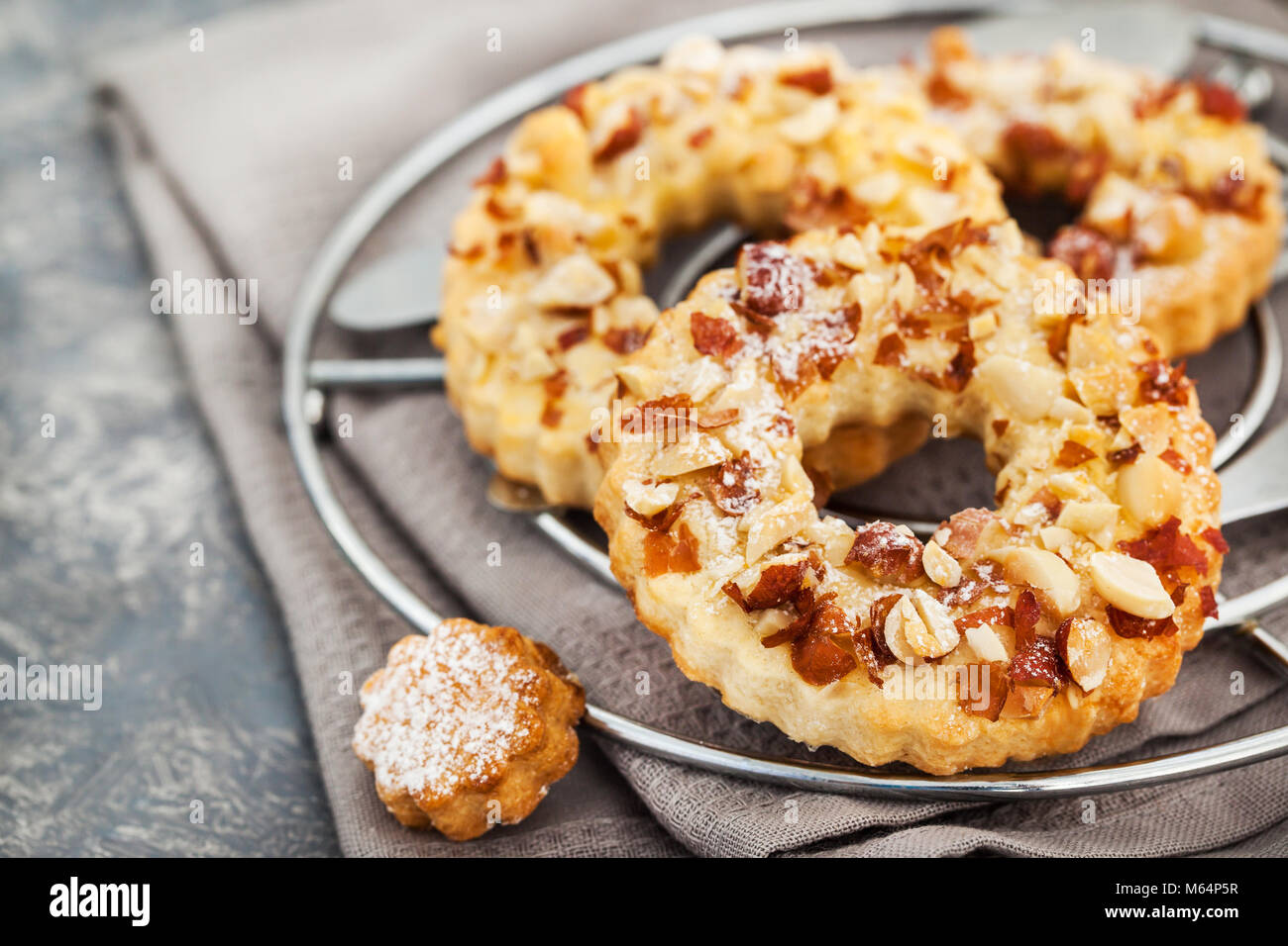 Ring shortbread cookies with peanuts on top Stock Photo - Alamy