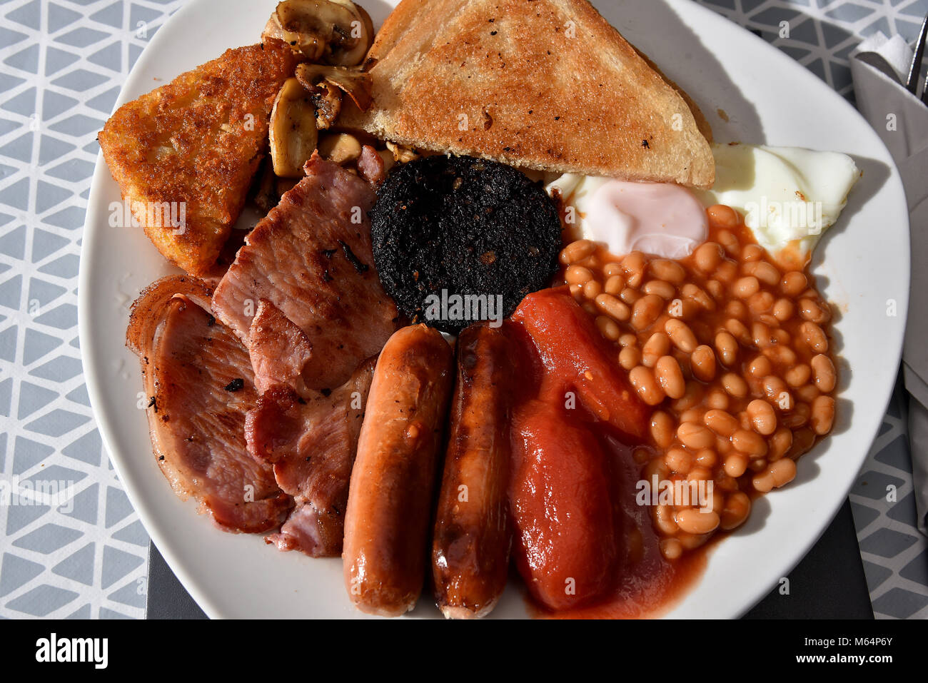 Full English Breakfast comprising of bacon, sausages, baked beans, hash ...