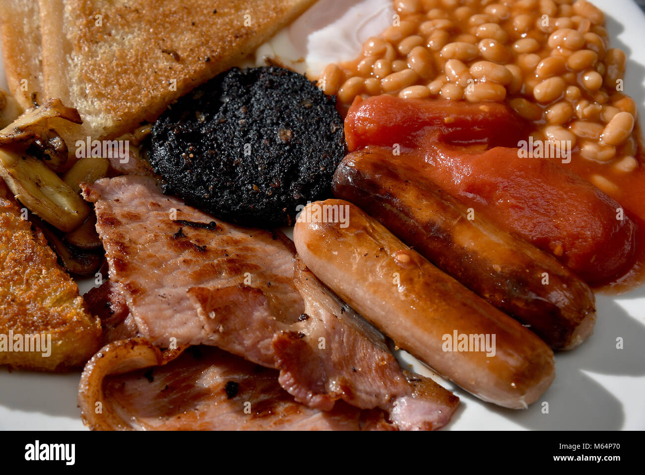 Full English Breakfast comprising of bacon, sausages, baked beans, hash ...