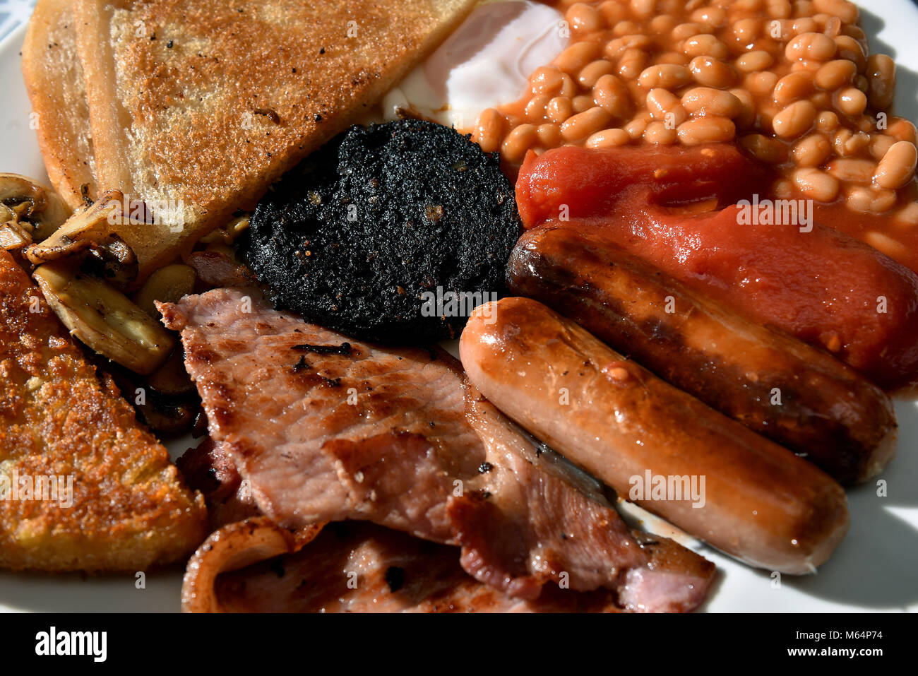 Full English Breakfast comprising of bacon, sausages, baked beans, hash ...