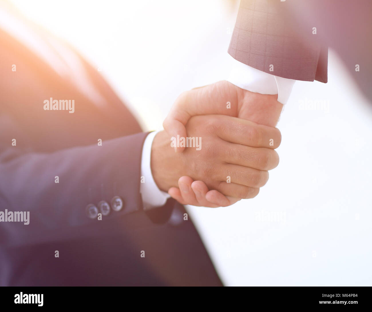 Handshake between two men in hi-res stock photography and images - Alamy