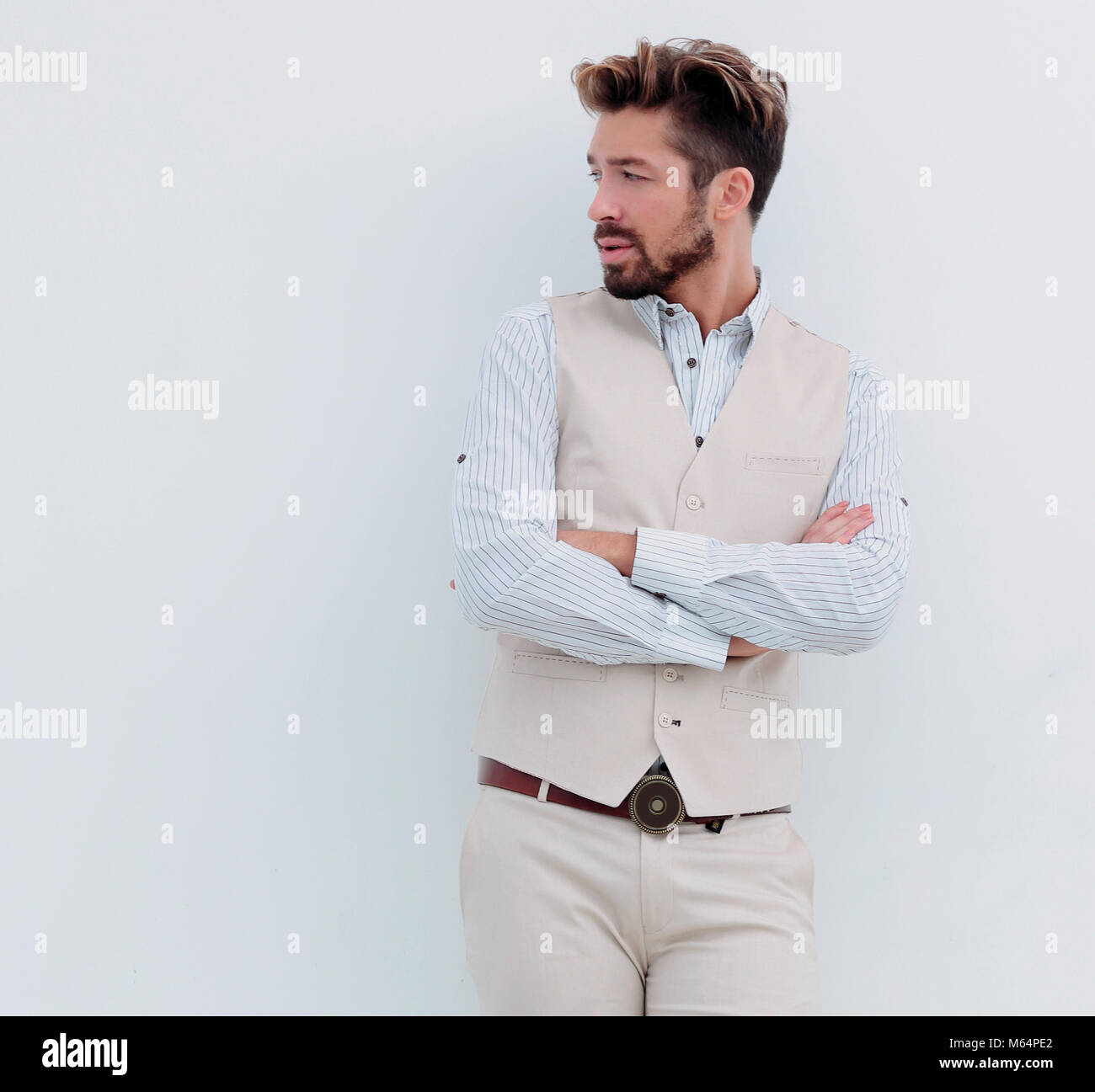 Full length portrait of stylish man with crossed hands Stock Photo - Alamy