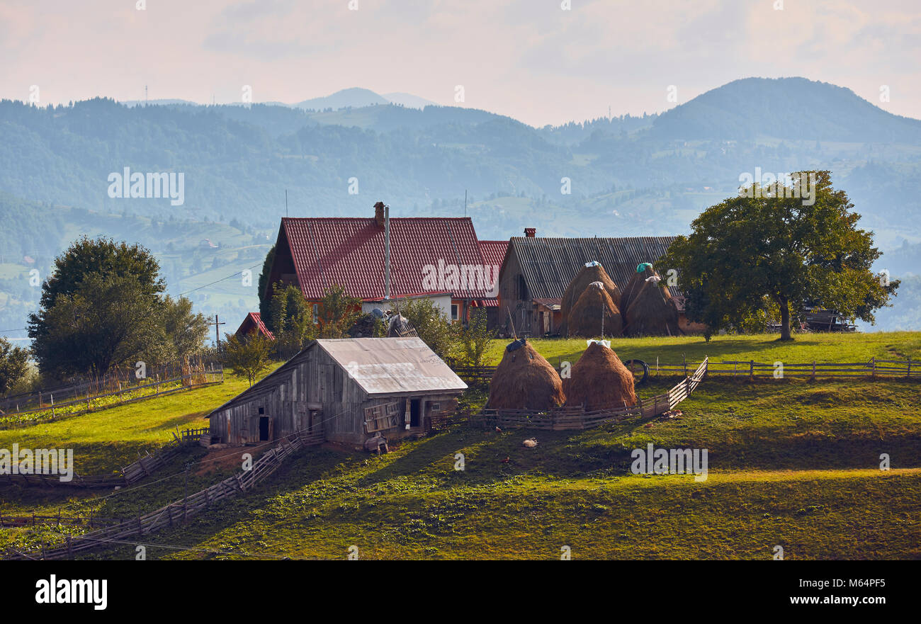 Springtime rural landscape. Traditional Transylvanian house with rustic ...