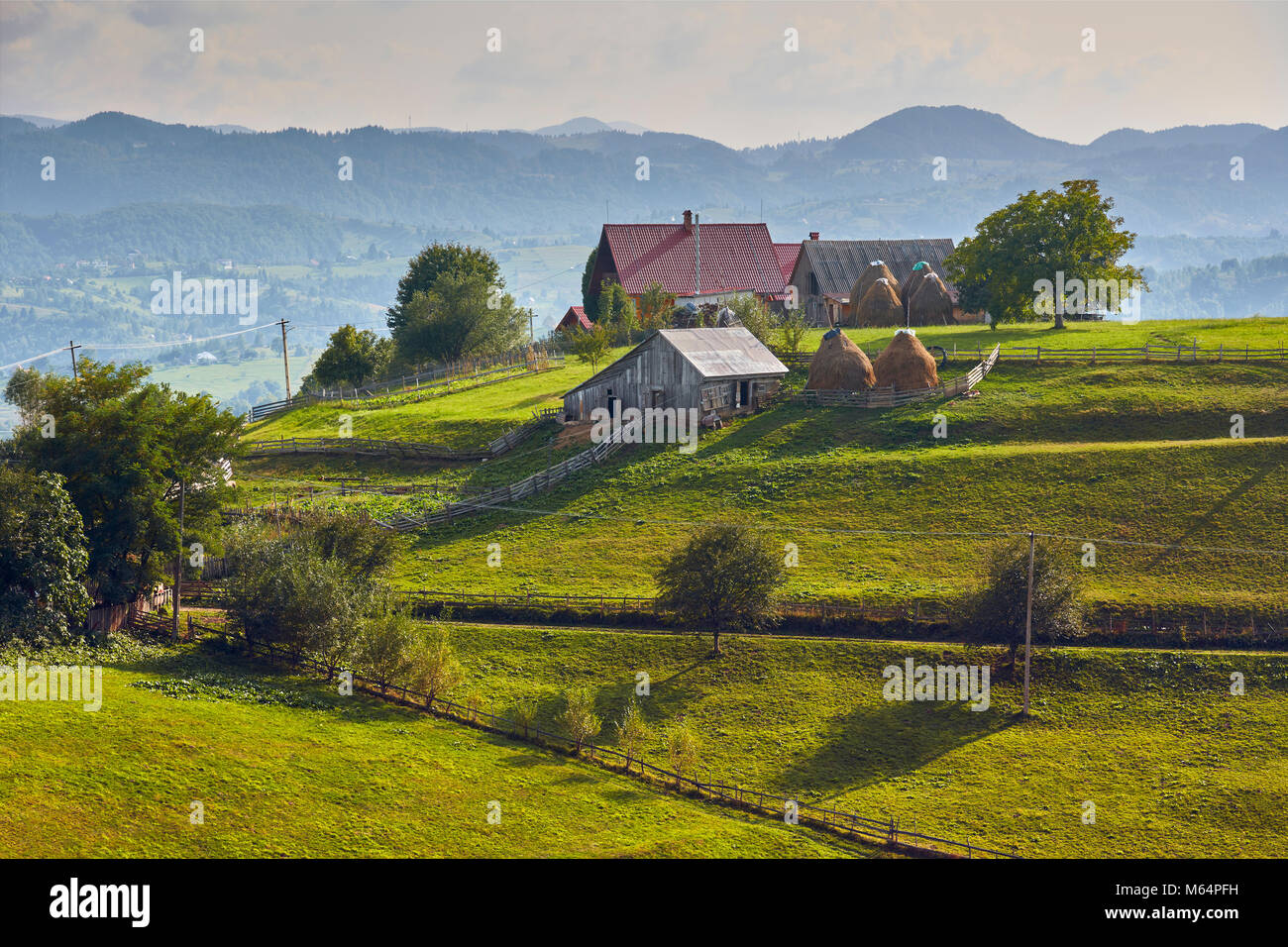 Springtime rural landscape. Traditional Transylvanian village on top of ...