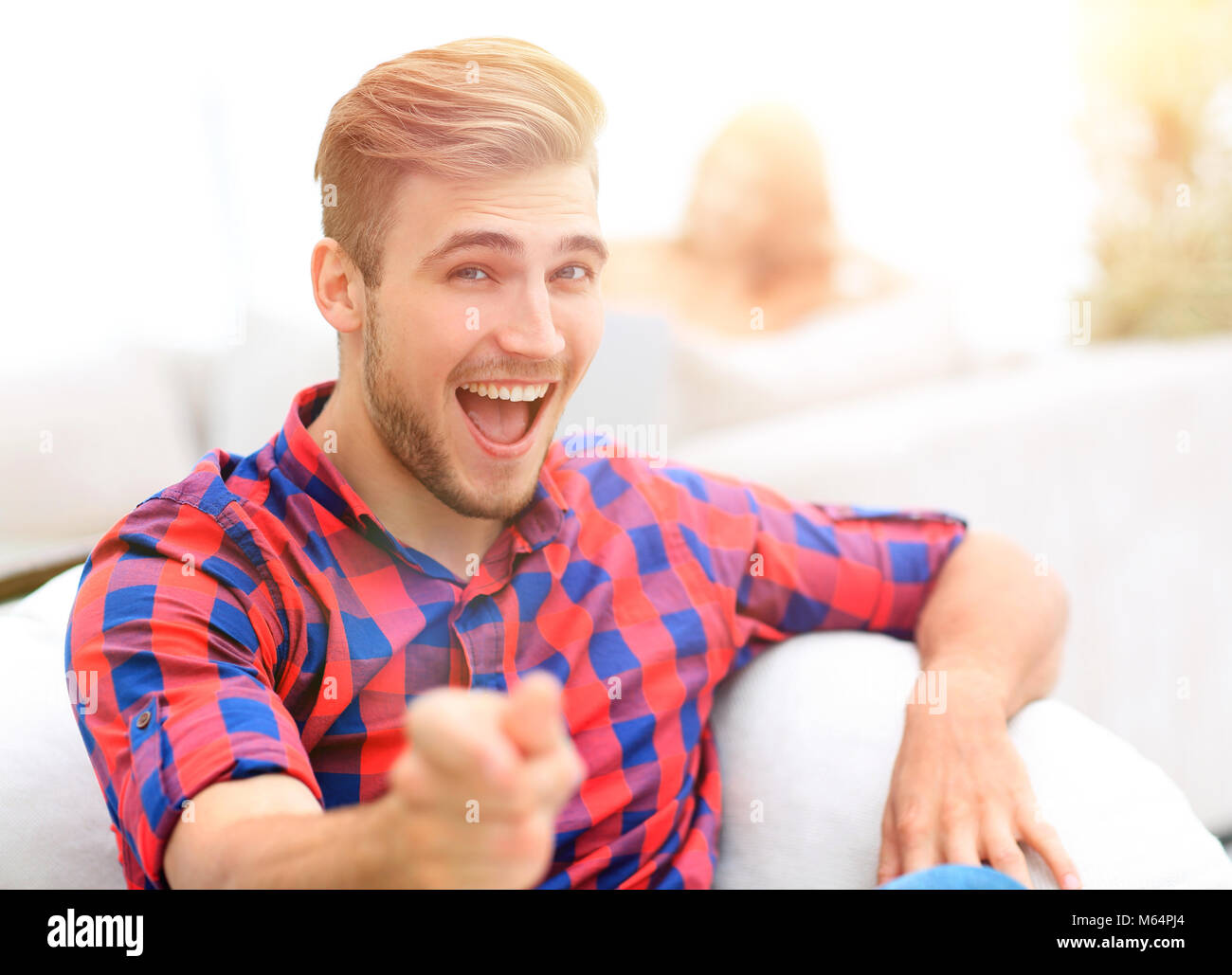 closeup of happy young man showing forward Stock Photo - Alamy