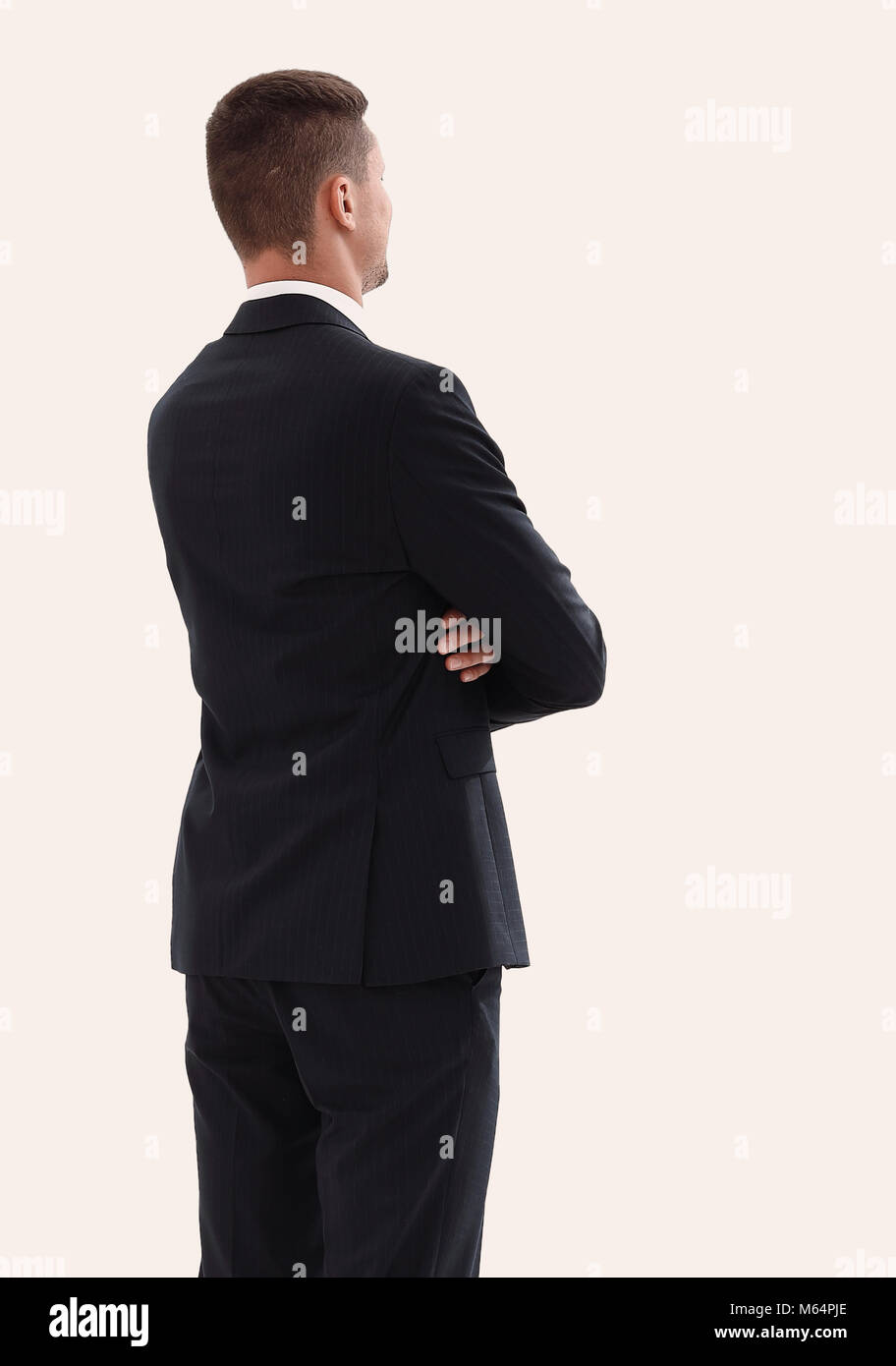 rear view.confident businessman with briefcase Stock Photo - Alamy