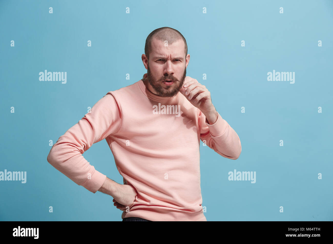 Suspiciont. Doubtful pensive man with thoughtful expression making ...