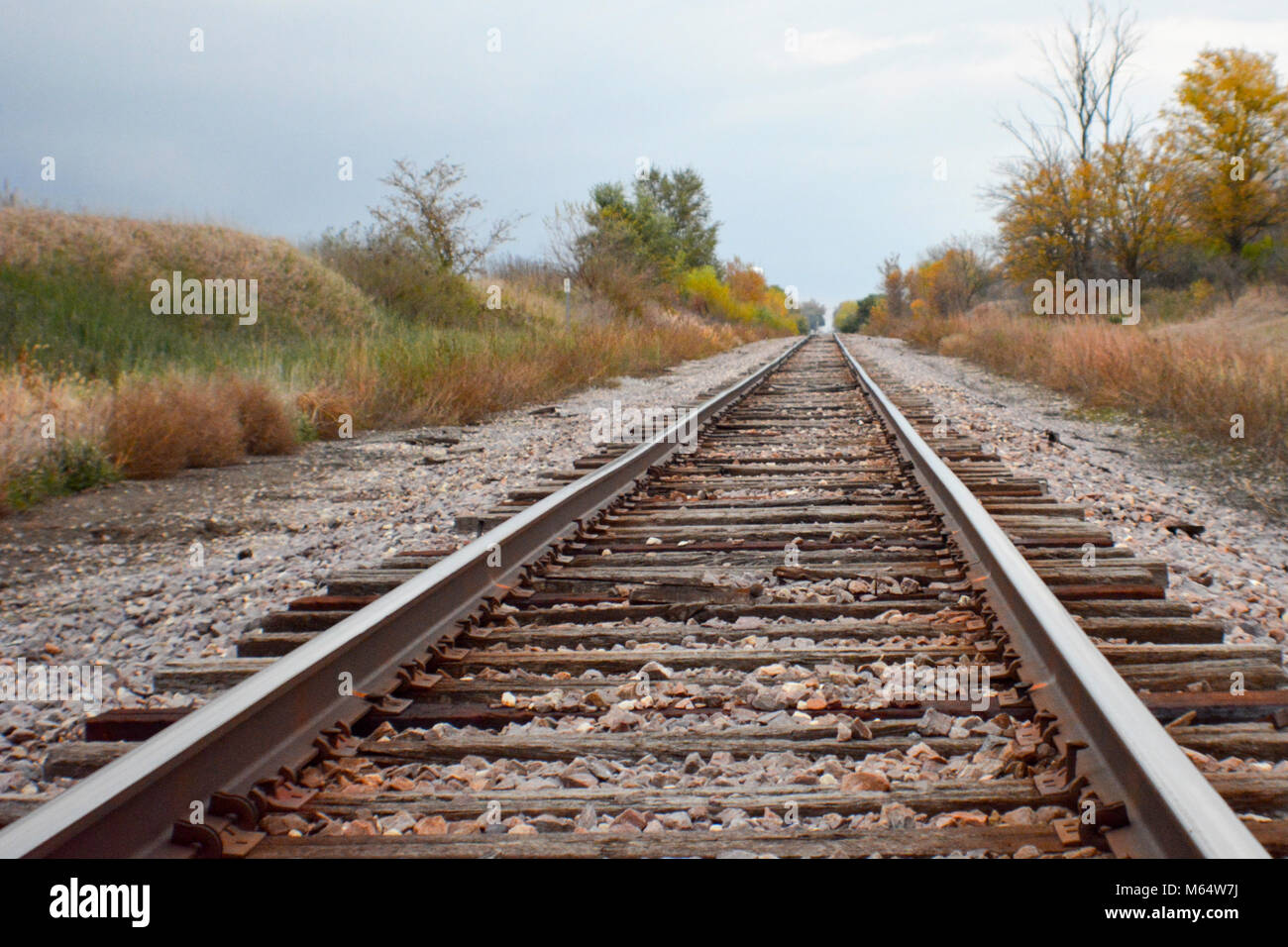 Train Tracks in Rural Iowa on a Gloomy Day meeting the horizon Stock ...