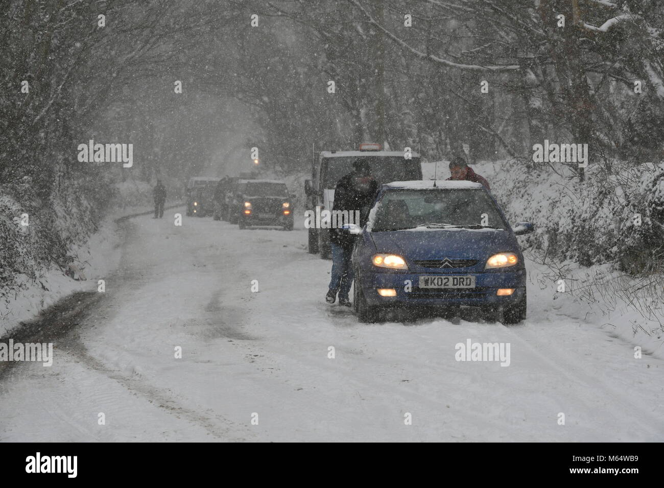 People push a car that became stranded on the A30 near Land's End in ...