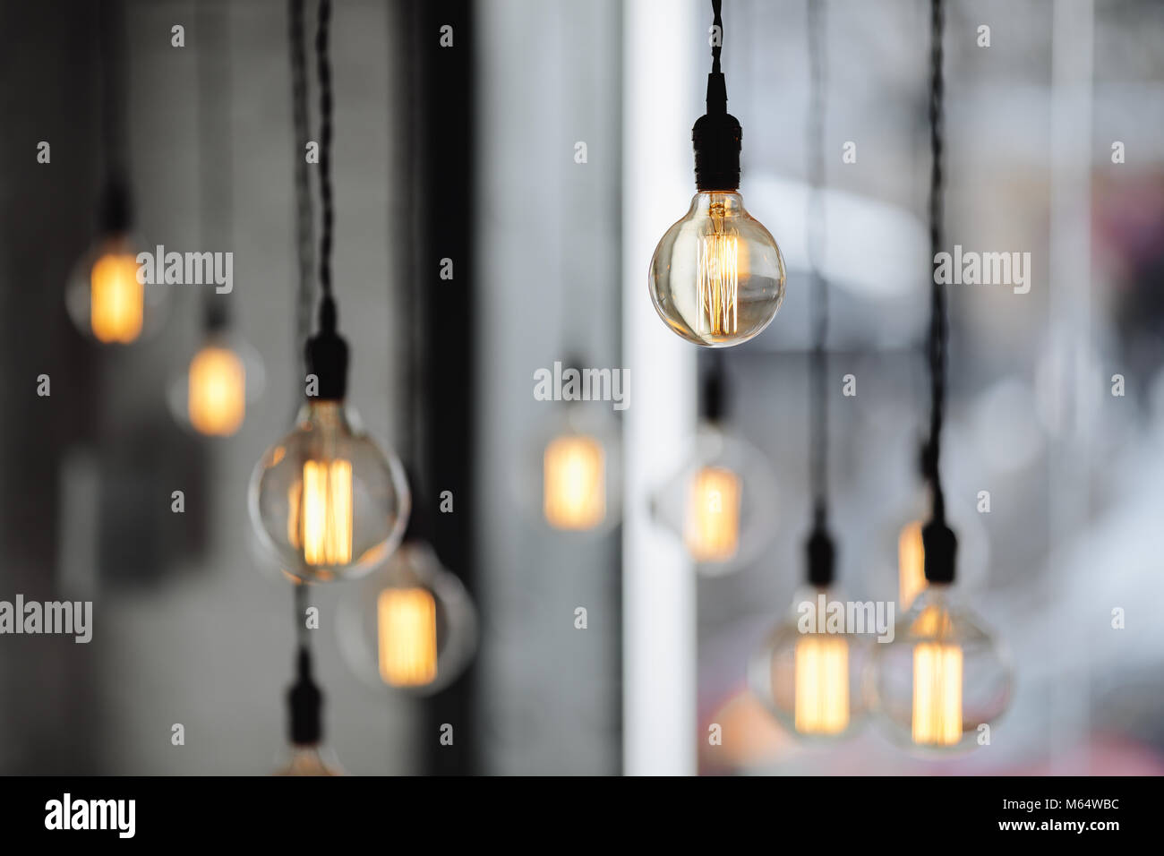Lamps on the coffee place with blur background Stock Photo - Alamy