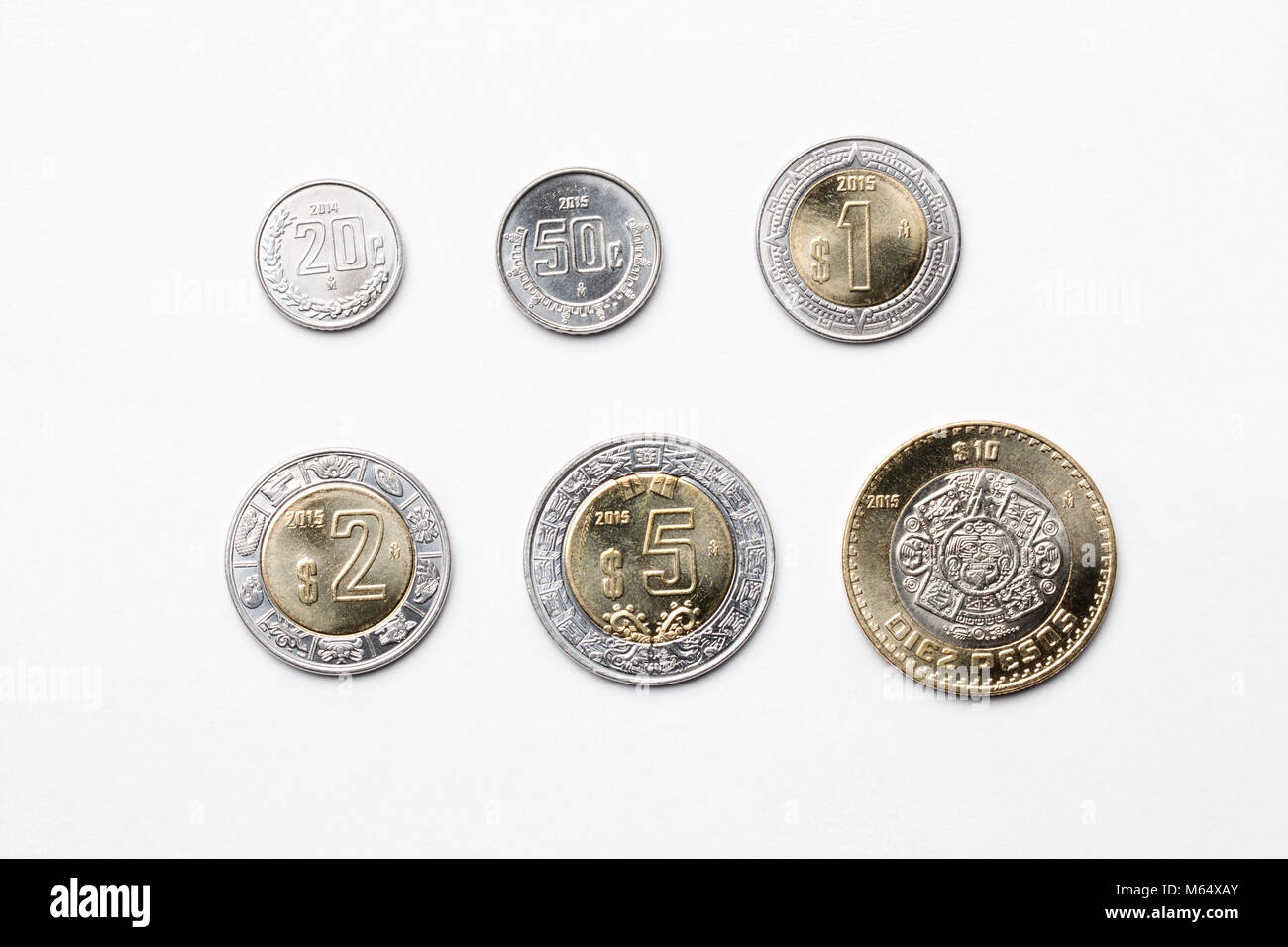 Mexican coins on a white background Stock Photo - Alamy