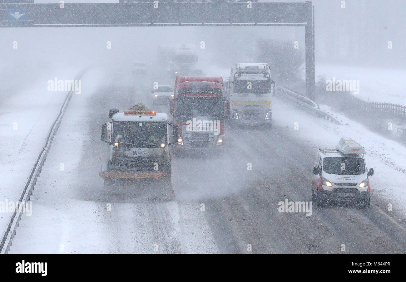 A snow plough on the M9 near Falkirk in heavy snow, as snow and sub ...