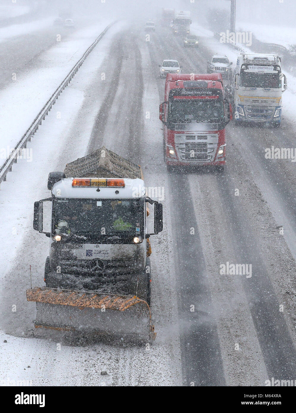 A snow plough on the M9 near Falkirk in heavy snow, as snow and sub ...