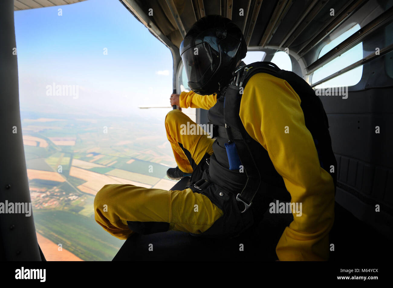 Parachutist in the airplane before jump on sunny day Stock Photo - Alamy