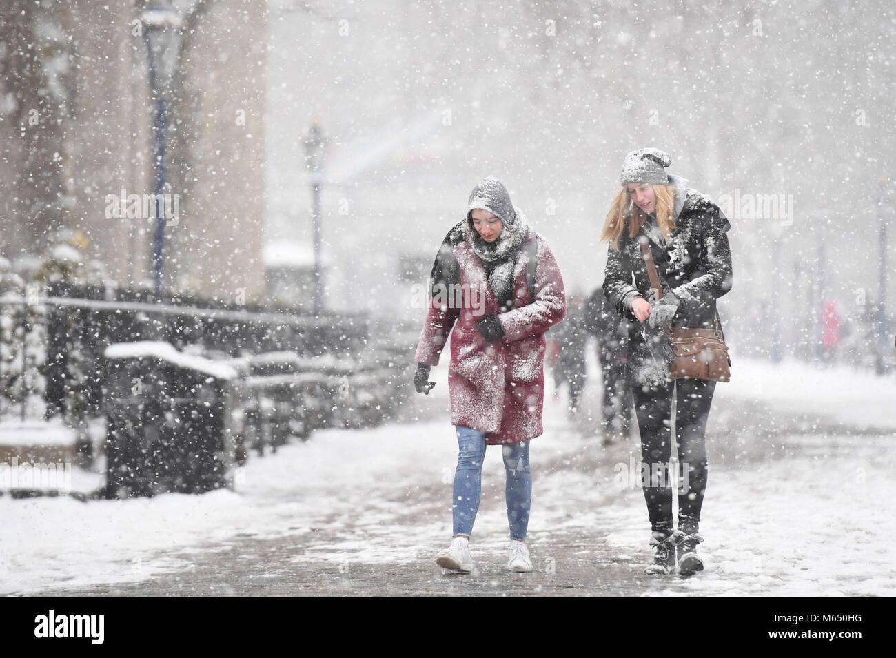 People walking in the snow by Tower Bridge in London, as the highest ...