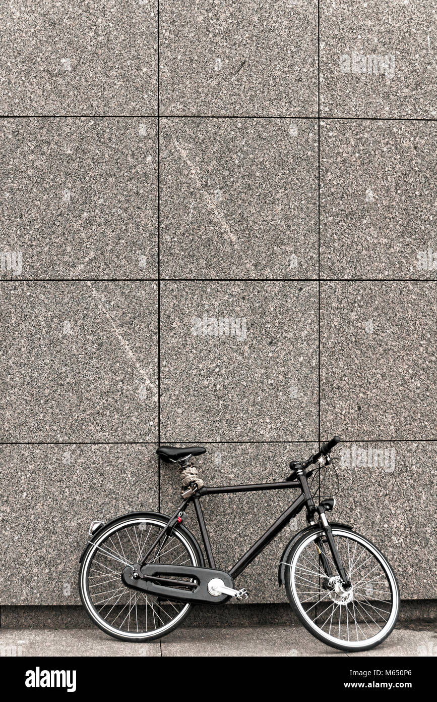 bicycle placed against a marble wall Stock Photo - Alamy
