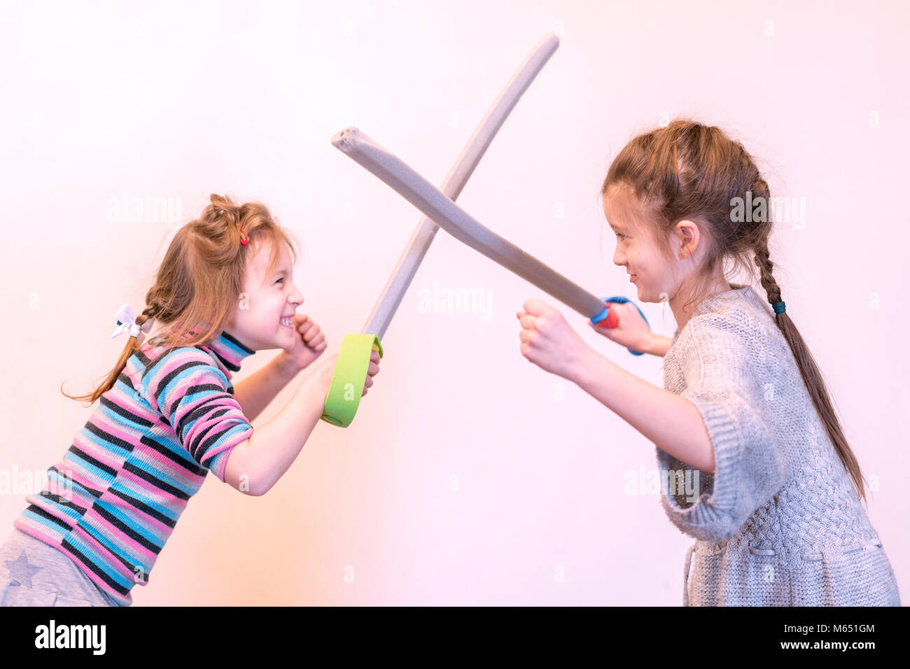 Two girls fight toy hi-res stock photography and images - Alamy