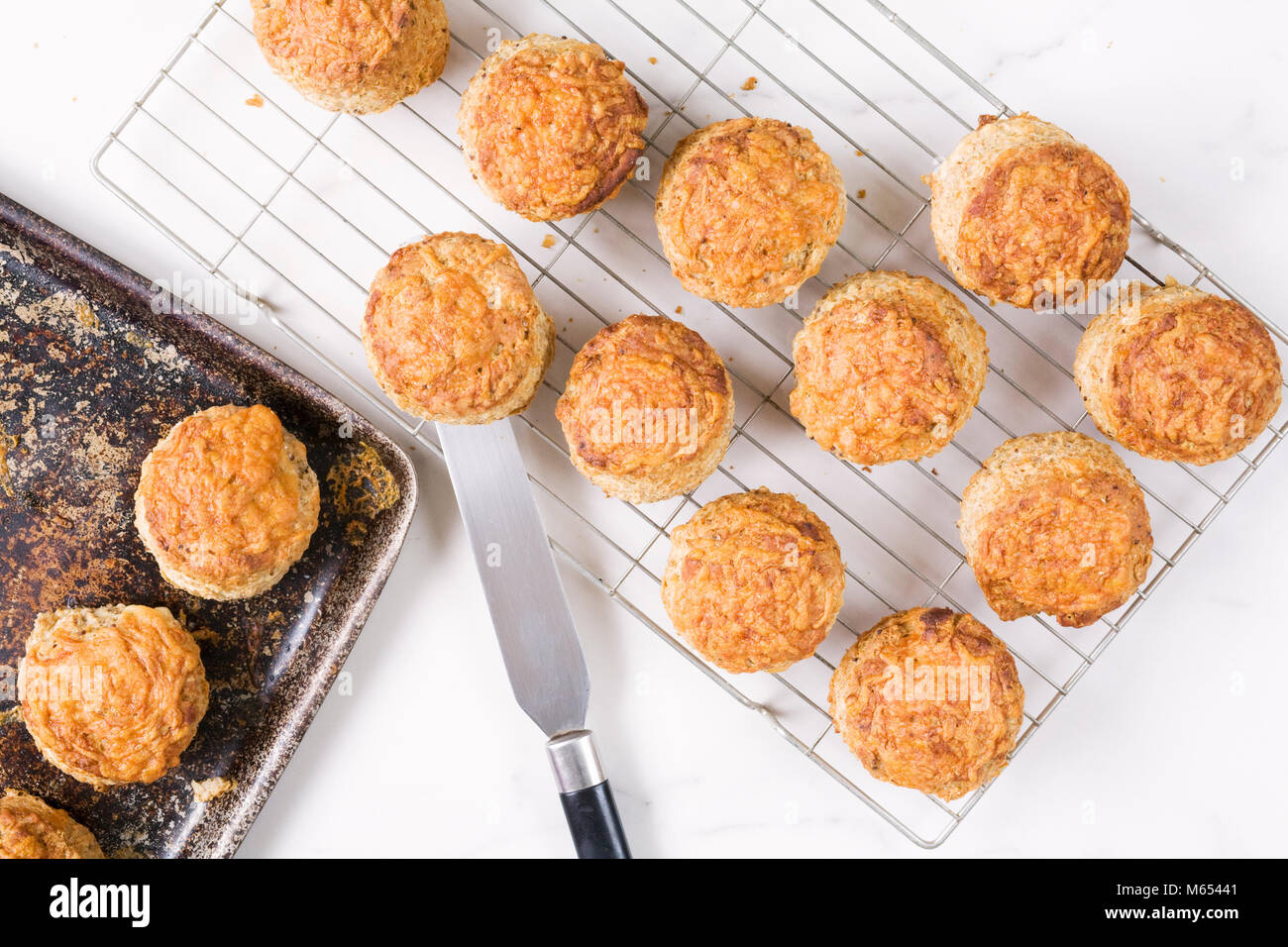 Freshly baked cheese scones cooling on a wire tray Stock Photo - Alamy