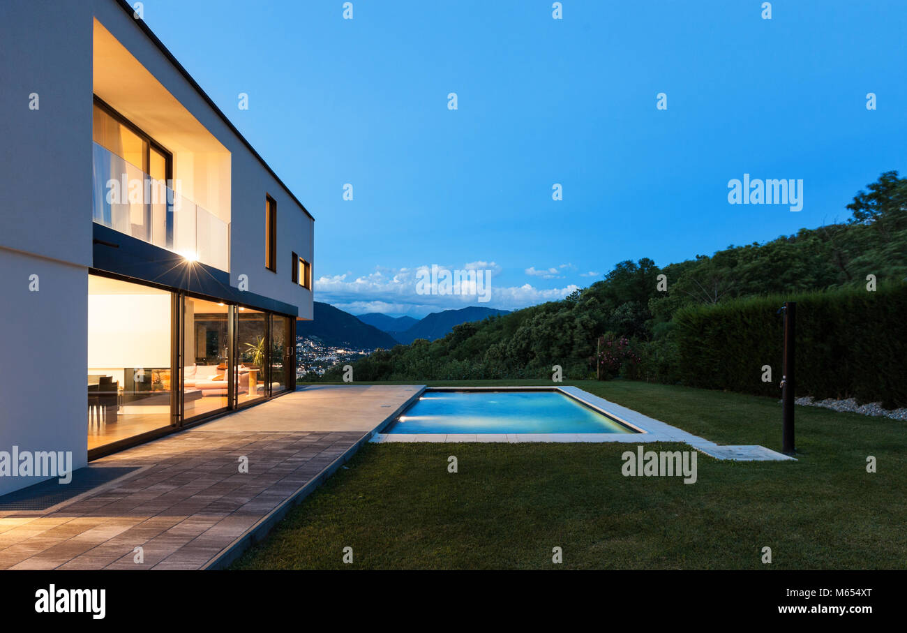 Modern villa with pool, night scene Stock Photo - Alamy