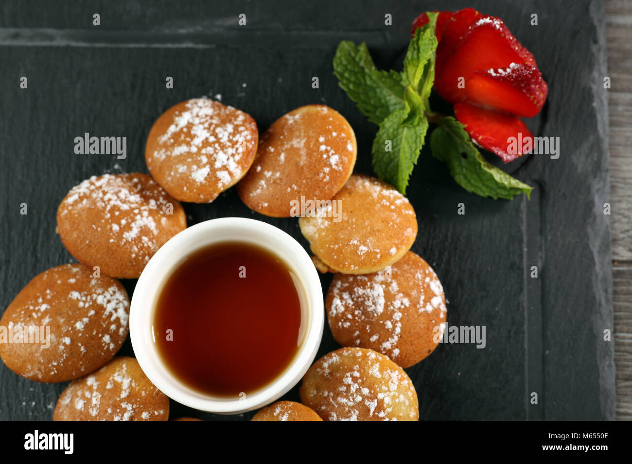 Mini pancakes with strawberry & syrup Stock Photo - Alamy