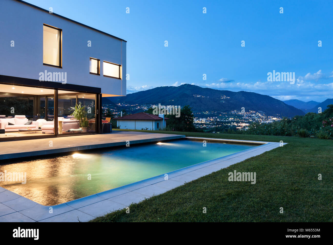 Modern villa with pool, night scene Stock Photo - Alamy