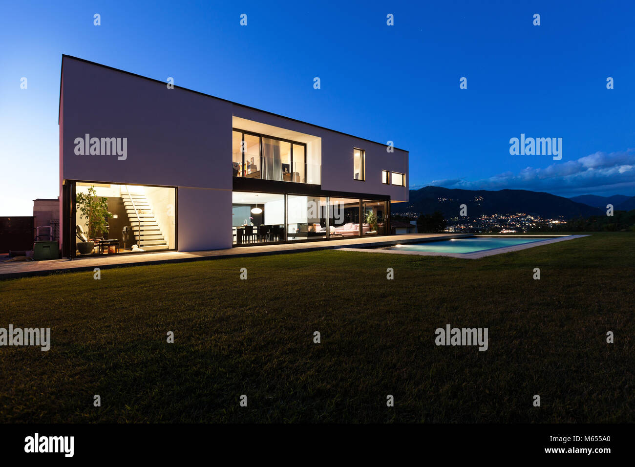 Modern villa with pool, night scene Stock Photo - Alamy