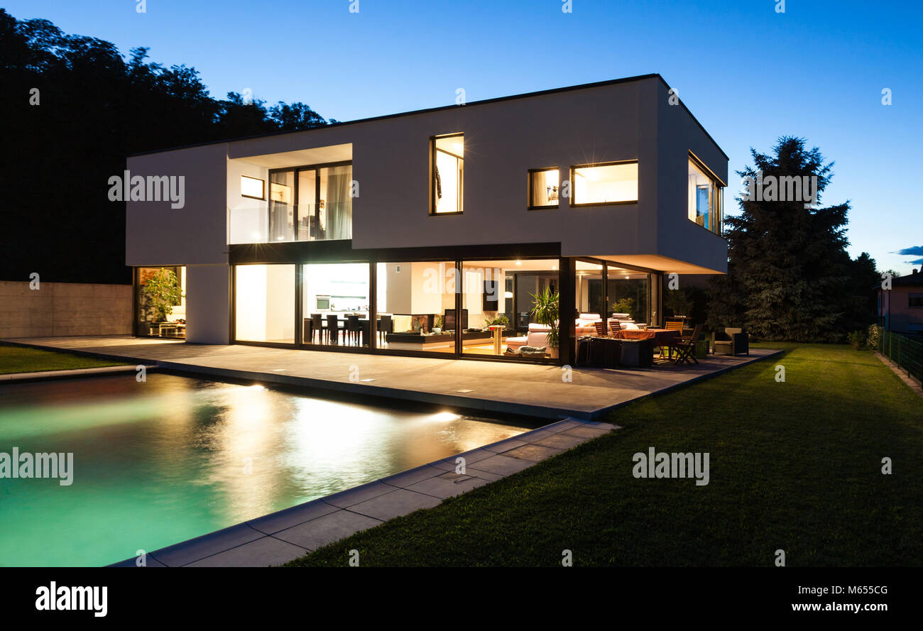 Modern villa with pool, night scene Stock Photo - Alamy