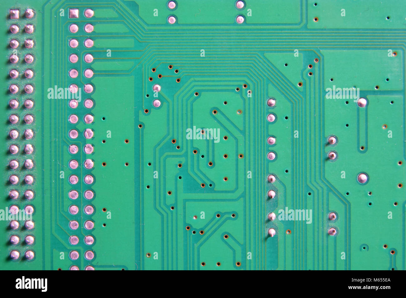 Close-up of the backside of a green circuit board Stock Photo - Alamy