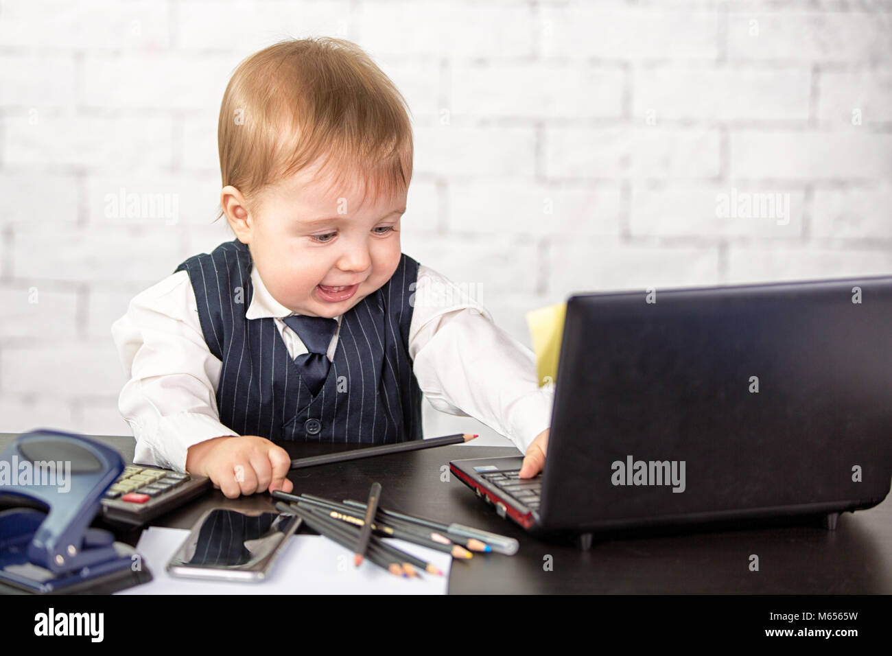Child in business suit hi-res stock photography and images - Alamy