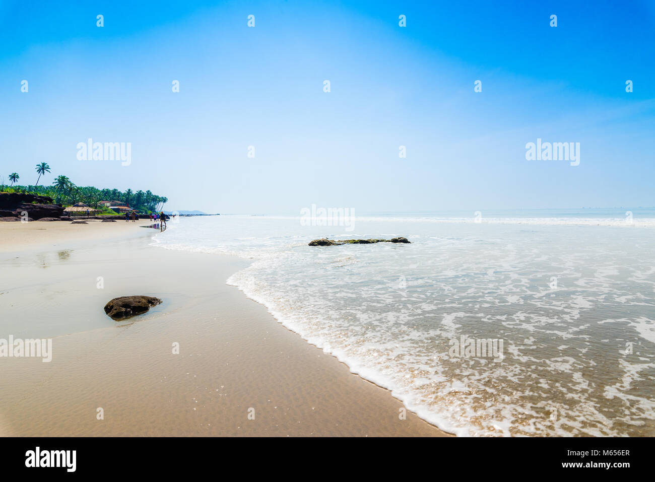 Beautiful sand, rocks and tranquil waves at Ashwem Beach, Goa Stock ...