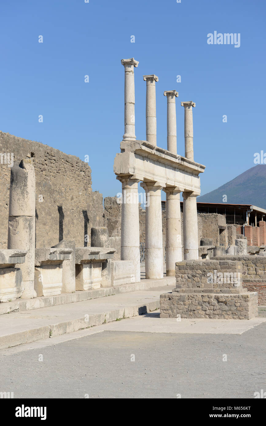 Row of marble columns at famous ancient town Pompeii with part of Mount ...