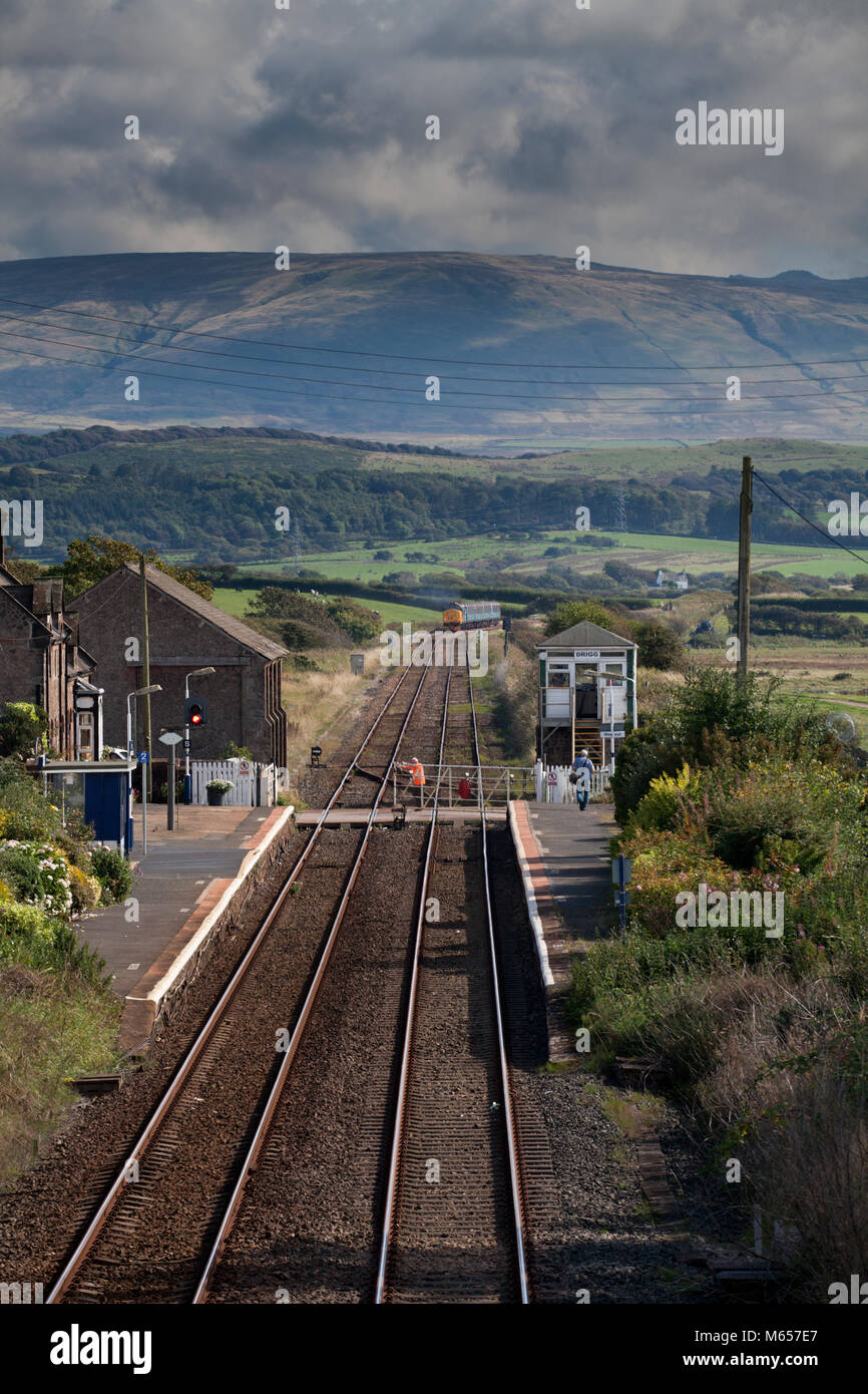 The signal man opens the manual crossing gates to road traffic after ...