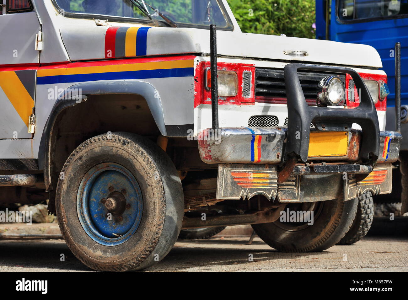 Filipino white-color striped dyipni-jeepney. Public transport in Sagada ...