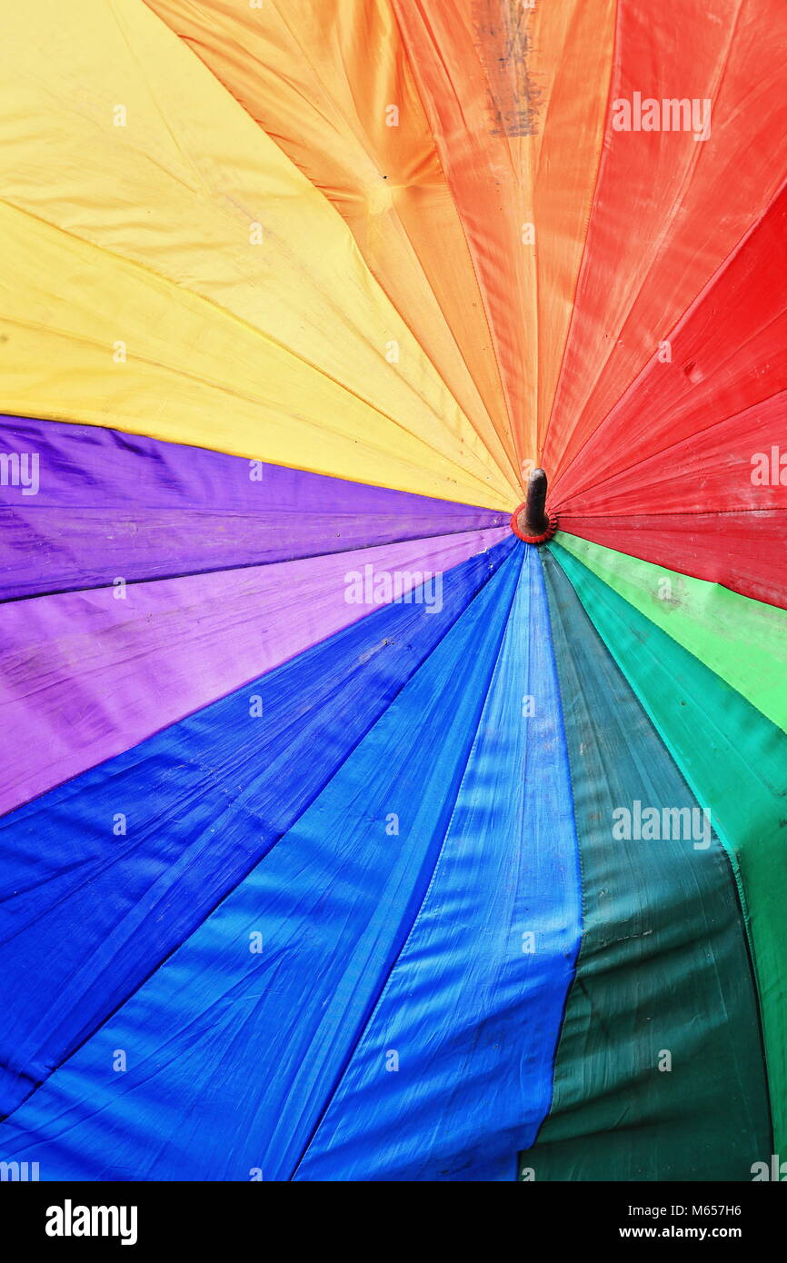 Colorful LGBT rainbow umbrella belonging to an old Ifugao woman wide ...