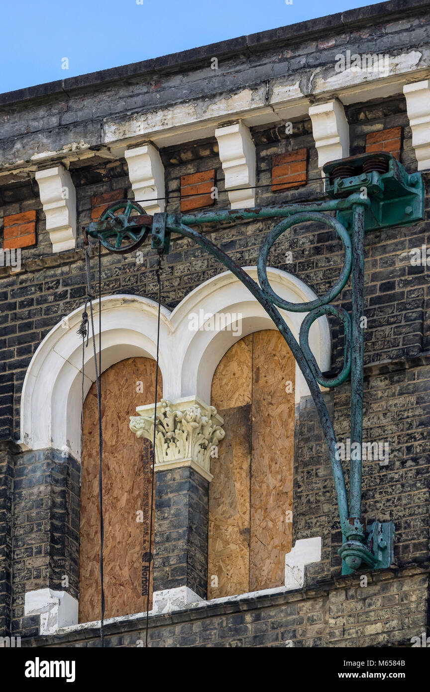 LONDON, UK - FEBRUARY 18, 2018: Old Victorian hoist on Building in ...