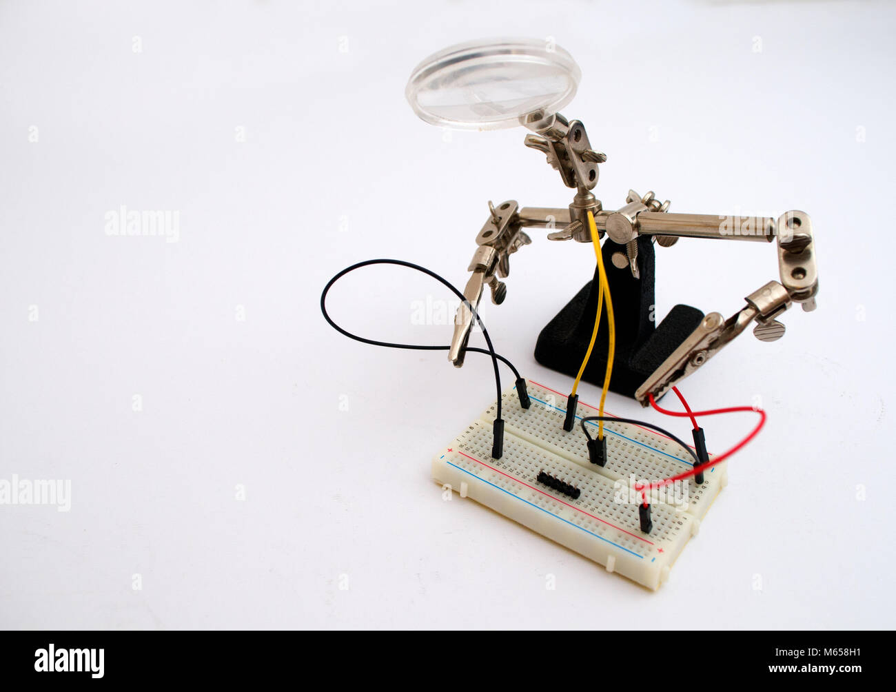 Robot for the coupling of wires on the board Stock Photo - Alamy