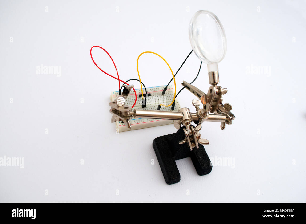 Robot for the coupling of wires on the board Stock Photo - Alamy