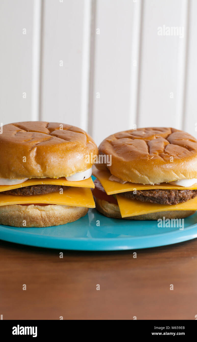 A pair of veggie cheeseburgers on sweet buns Stock Photo - Alamy