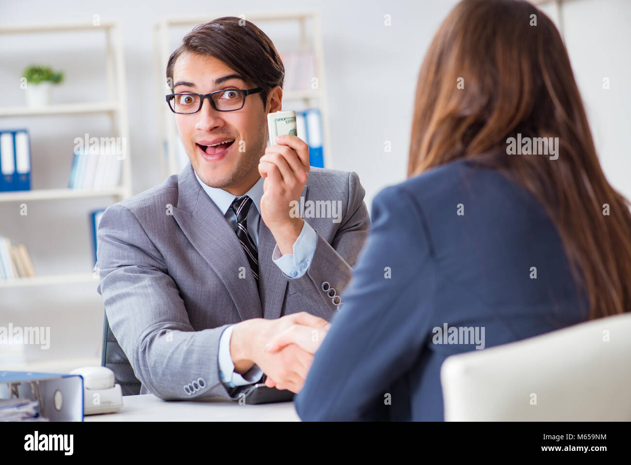 Woman offering bribe businessman hi-res stock photography and images ...