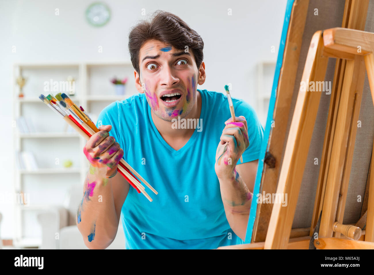Portrait young upset man paint hi-res stock photography and images - Alamy