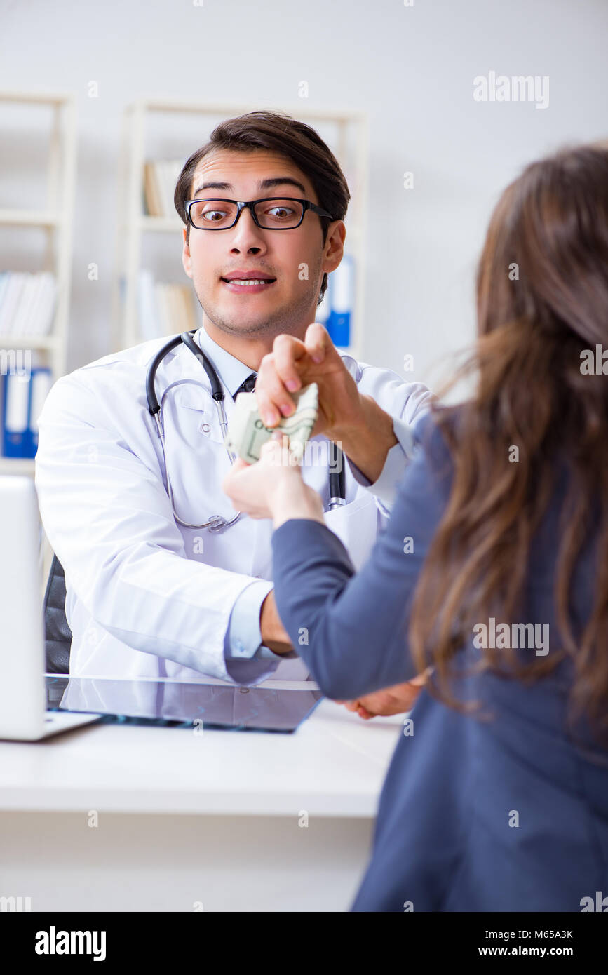 Doctor in corruption concept with being offered bribe Stock Photo - Alamy