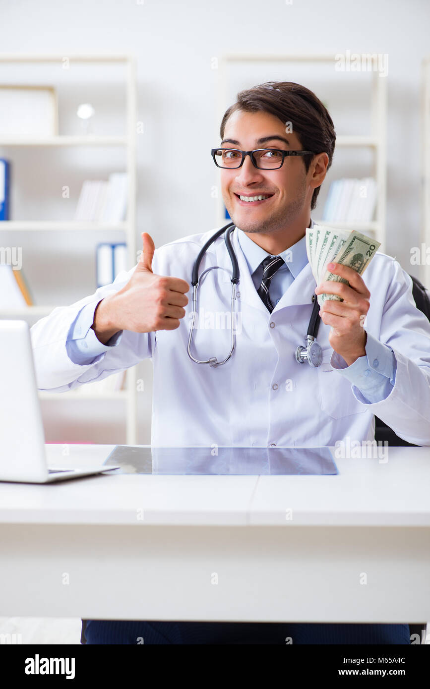 Doctor in corruption concept with being offered bribe Stock Photo - Alamy