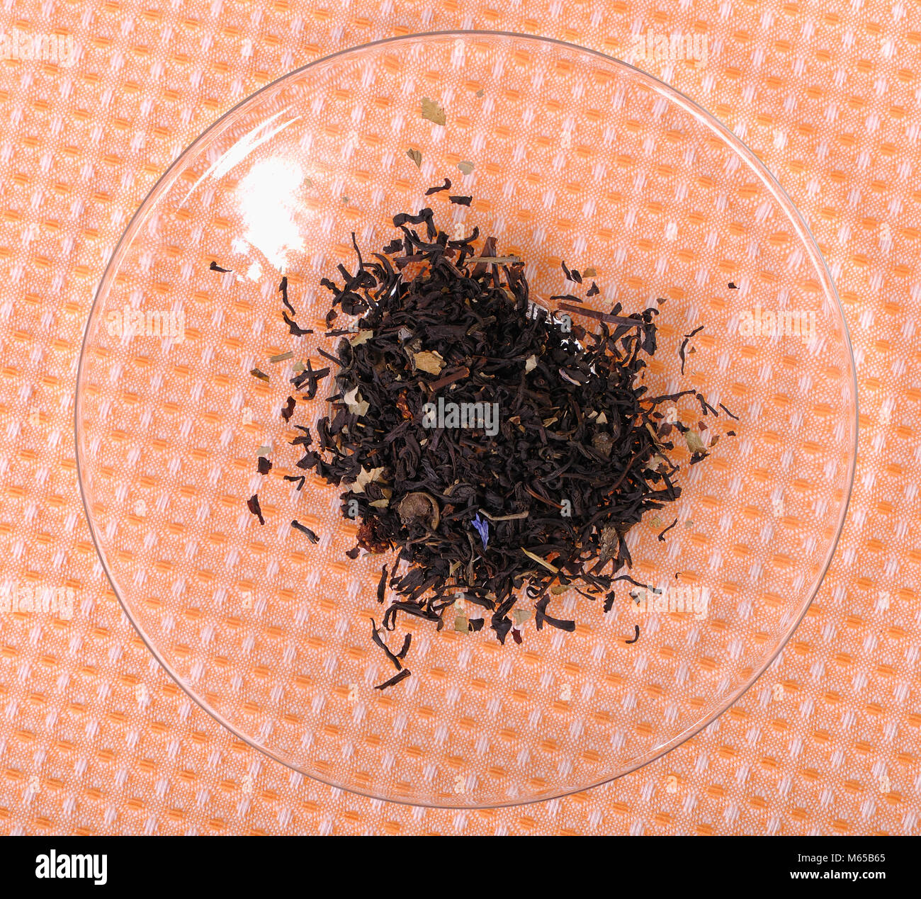 A pile of tea leaves on a glass saucer Stock Photo - Alamy