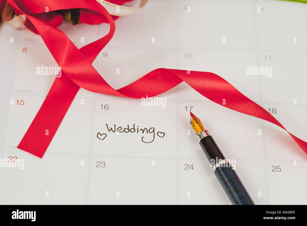 Reminder Wedding day in calendar planning and fountain pen with color ...