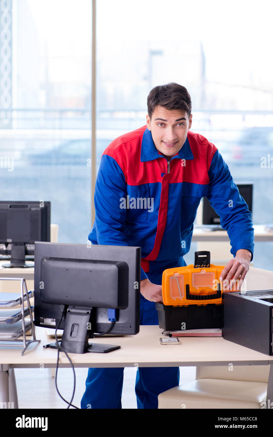 Computer repairman specialist repairing computer desktop Stock Photo ...