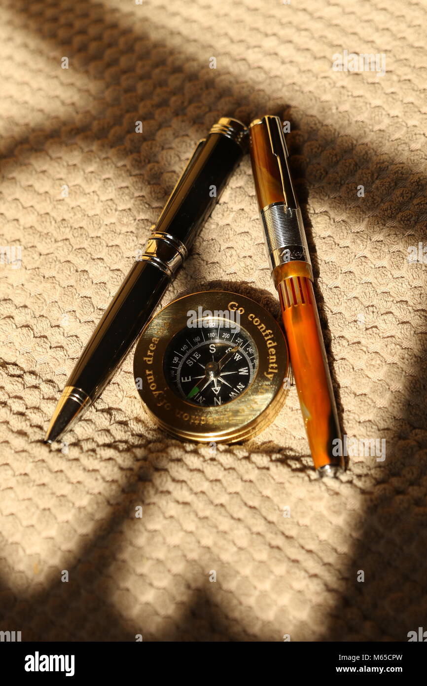 Pen and compass Stock Photo - Alamy